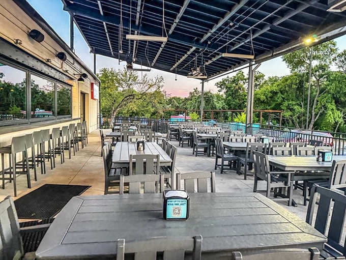 Spacious outdoor seating with river views turns your barbecue feast into a proper Texas experience.