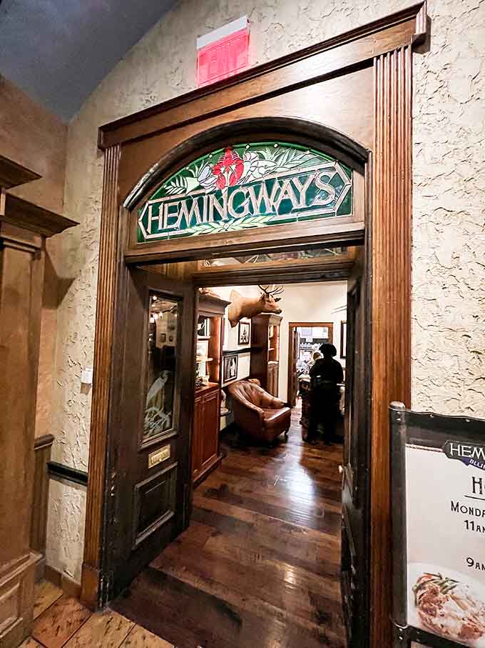 That elegant entryway with its arched doorway and tropical signage hints at the aquatic adventure waiting inside.