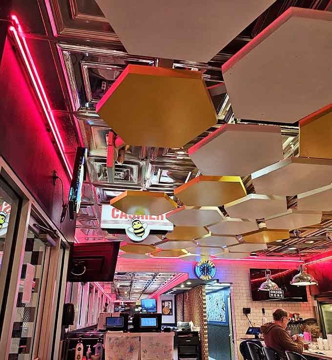 Those honeycomb ceiling panels aren't just decoration, they're a commitment to the theme that borders on performance art.