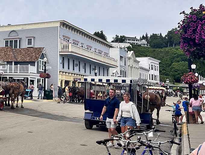 Main Street Mackinac Island where horses outnumber cars and Horn's turquoise facade stands out like a welcoming beacon.