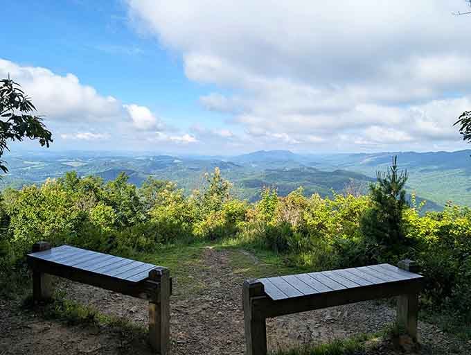 Benches positioned perfectly for contemplating life's mysteries or simply enjoying the spectacular mountain panorama before you.
