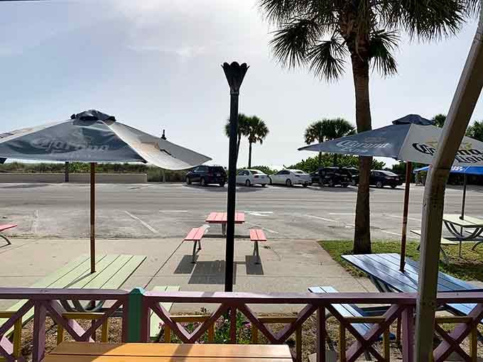Palm trees and picnic tables create the perfect spot for casual outdoor dining with a side of Gulf breeze.