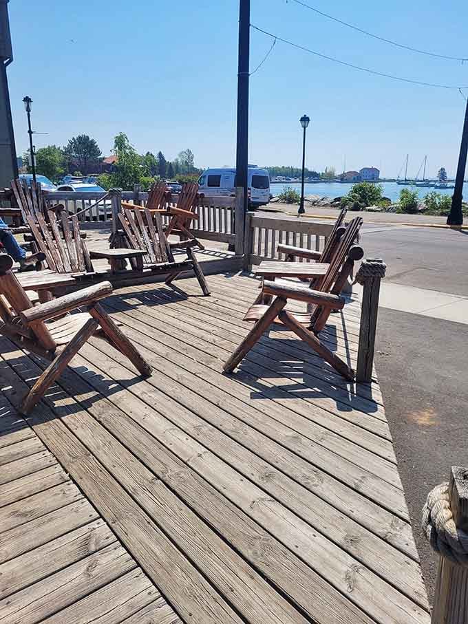 Adirondack chairs facing the harbor are basically an invitation to cancel all your plans.