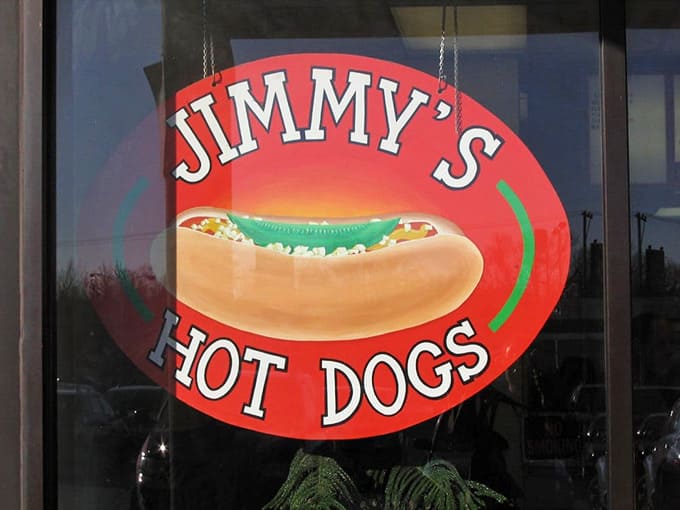 That cheerful logo with the loaded hot dog promises exactly what you're going to get: pure satisfaction.