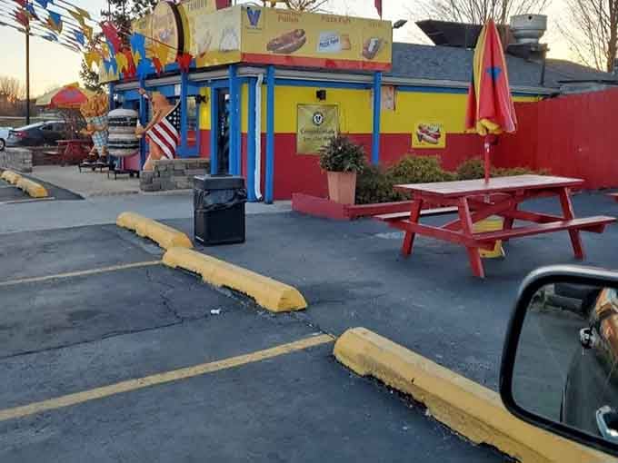 Outdoor seating with colorful umbrellas transforms a parking lot into your own personal summer dining room.