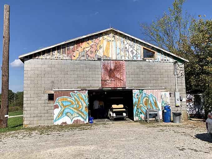 The colorful barn serves as both workshop and gallery, proving that art studios don't need fancy addresses.
