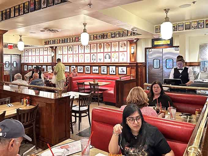 Real people enjoying real food in red booths, the universal language of deli happiness spoken fluently here.