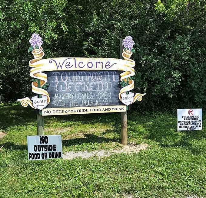 The welcome sign greets arriving guests, setting expectations for a day filled with archery, entertainment, and medieval merriment ahead.