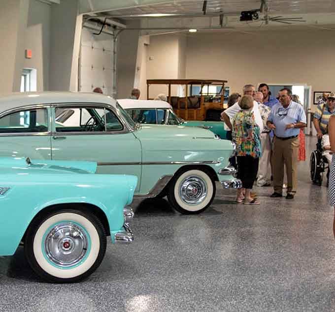 Visitors gather around these automotive treasures, sharing memories and marveling at the craftsmanship of yesteryear.