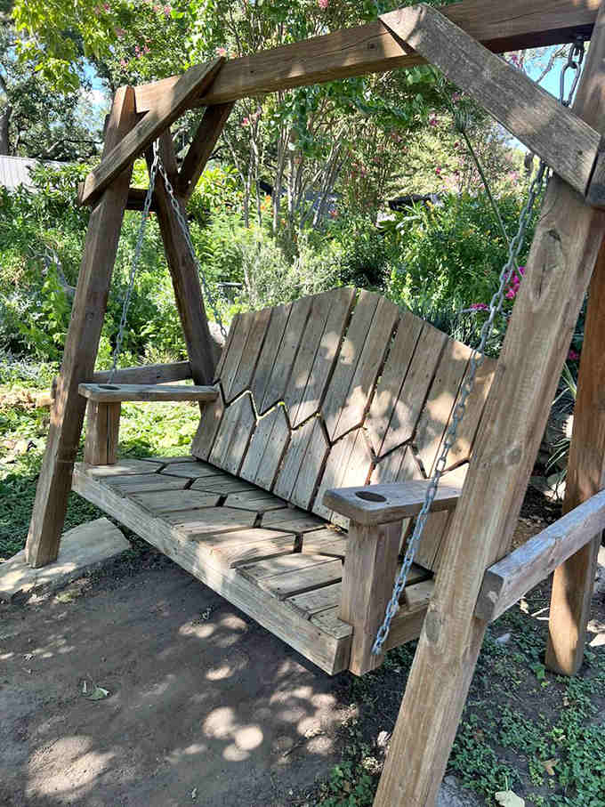 Rustic wooden swings in the garden area prove that simple pleasures really are the best, no assembly instructions required here.