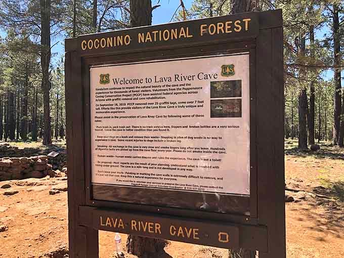 This welcome board prepares visitors for the self-guided adventure, emphasizing the importance of proper preparation and lighting.