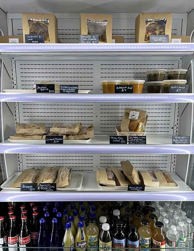 The refrigerated case holds grab-and-go items for those who want French quality without the wait or the fuss.