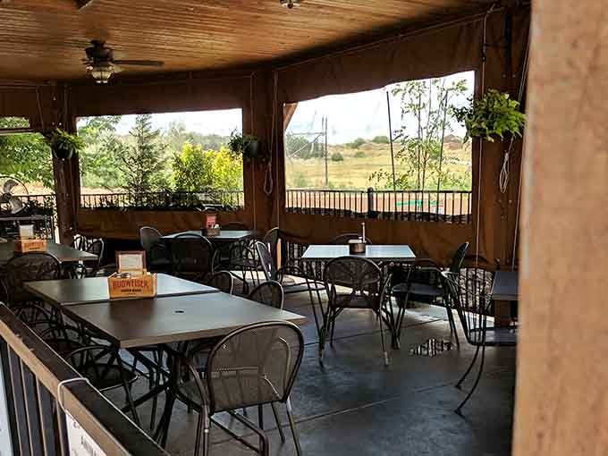 Covered patio seating offers fresh air and open views, perfect for those who want nature with dinner.