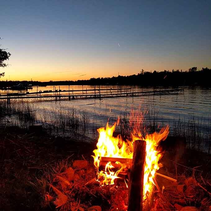 A bonfire by the water as the sun sets is the Upper Peninsula's version of dinner and a show.