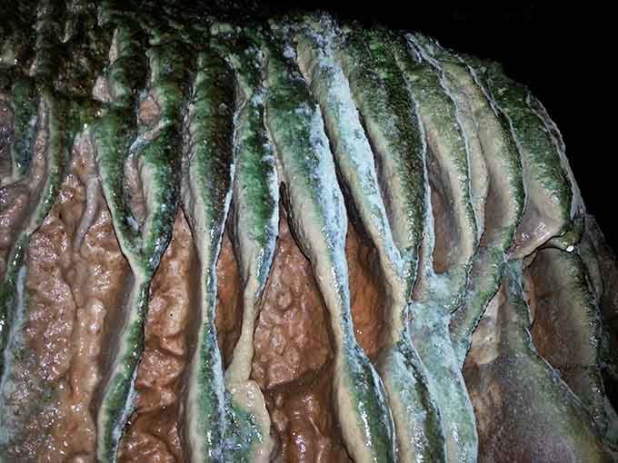 Nature's own abstract art gallery&mdash;limestone curtains draped by water over millennia, proving patience creates masterpieces.