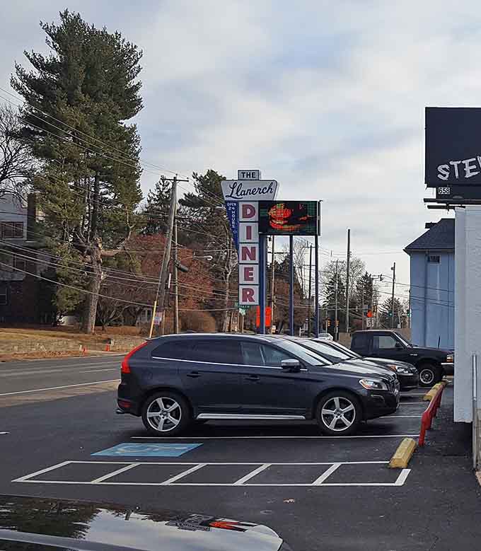 That iconic sign visible from the road, calling to hungry travelers like a delicious beacon.