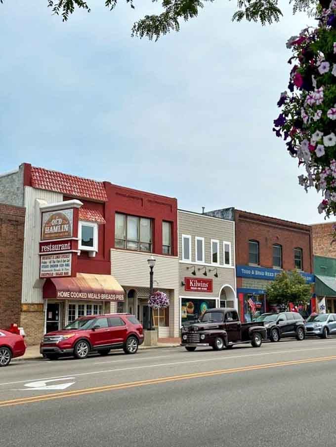 Hanging baskets and historic storefronts create Main Street charm that shopping malls spent billions trying unsuccessfully to replicate artificially.