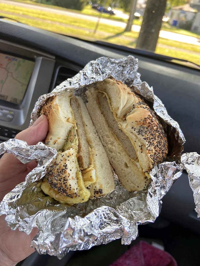 A bagel sandwich wrapped in foil like a gift you give yourself, because sometimes breakfast needs to be portable perfection.