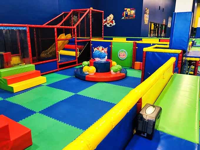 The dedicated toddler zone features age-appropriate equipment where little ones can safely explore and develop their motor skills.