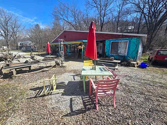 Colorful chairs sit ready in a gravel courtyard, waiting for visitors who appreciate charm over corporate polish and authenticity over algorithms.