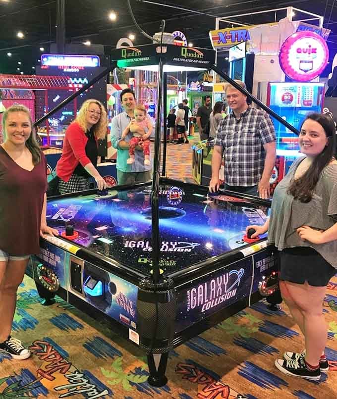 Real families having real fun around real arcade games, proving that screens are better when they involve actual human interaction together.