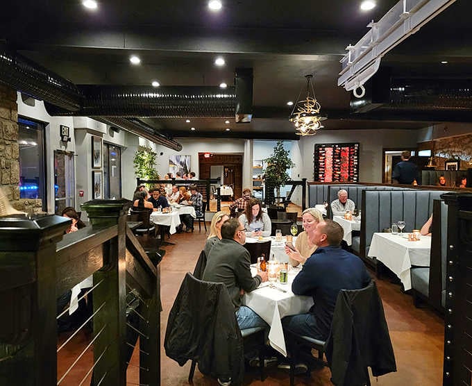 Happy diners enjoying their meals prove that good food and lake views create the perfect recipe for contentment.