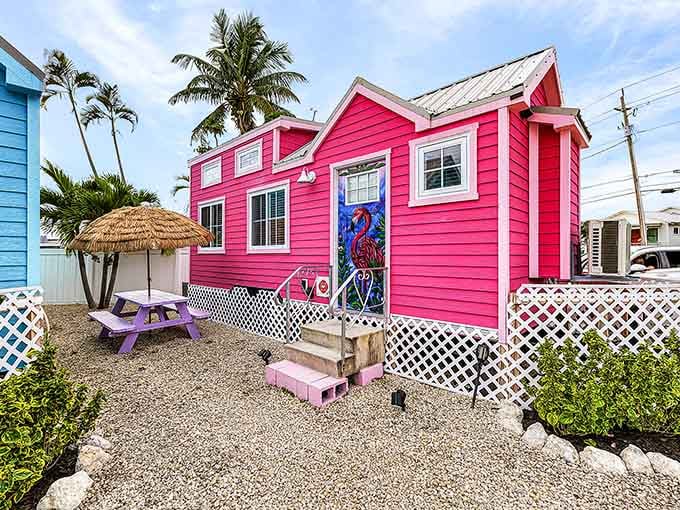 Bubble-gum pink cottage so adorable it looks like Barbie's beach house grew up and got real estate.