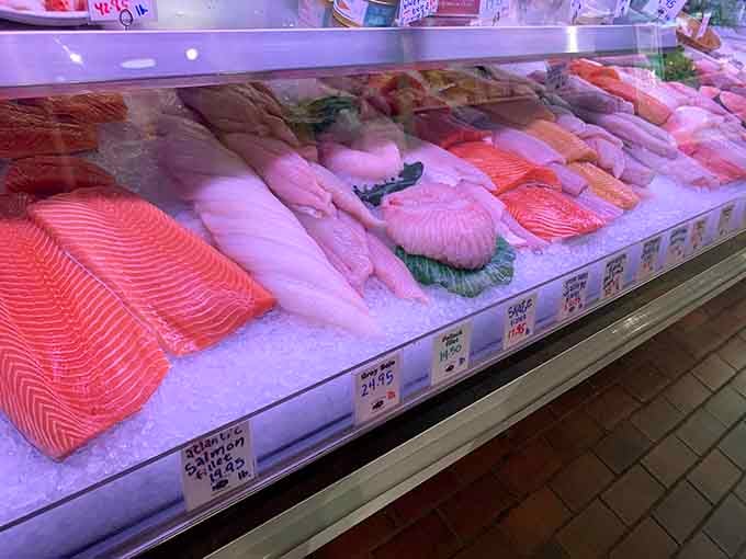 Fresh fillets displayed on ice like edible artwork, waiting to become tonight's dinner masterpiece.