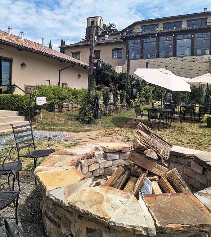 An outdoor fire pit surrounded by seating where you can pretend you're camping, except with better wine and food.