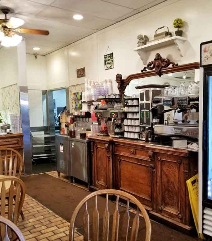 The coffee station featuring an ornate mirror that's probably witnessed more breakfast orders than you've had birthdays.