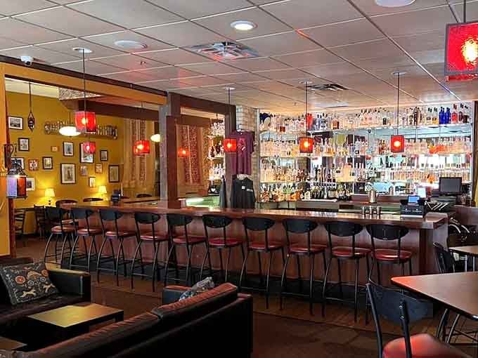 The well-stocked bar gleams with possibilities, featuring enough vodka varieties to make any Russian grandmother nod approvingly.