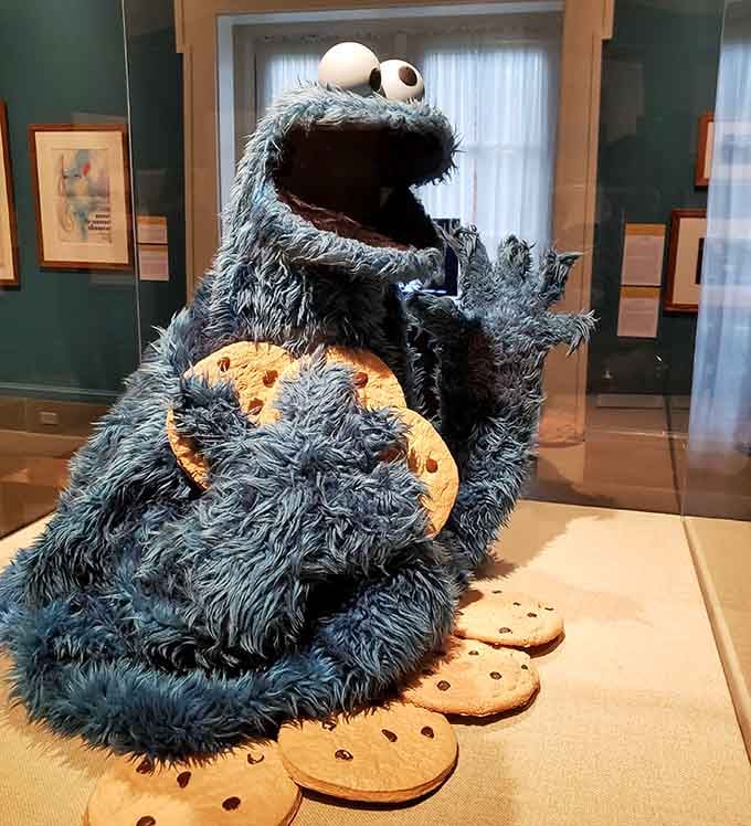 Cookie Monster makes a surprise appearance because even Sesame Street recognized Rockwell's influence on American visual culture.