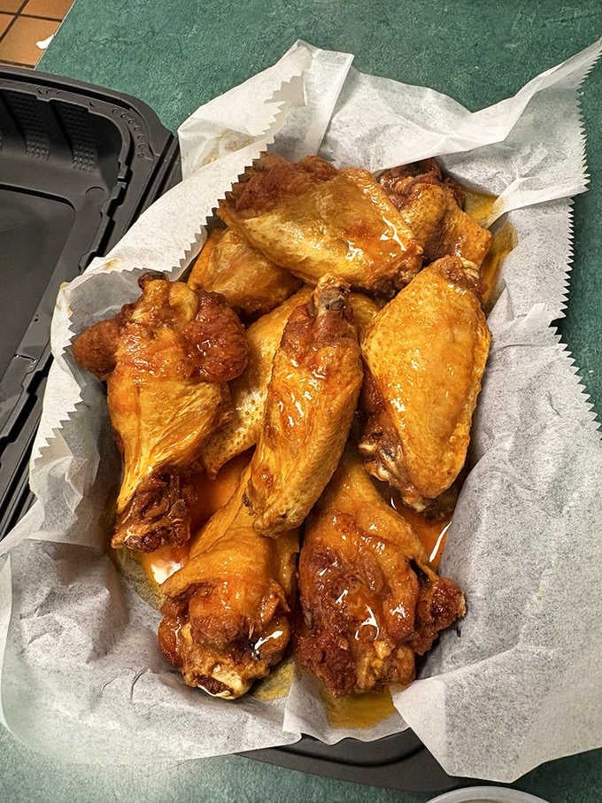 Wings glazed and glistening, ready to disappear faster than your willpower when faced with properly cooked poultry and good sauce.