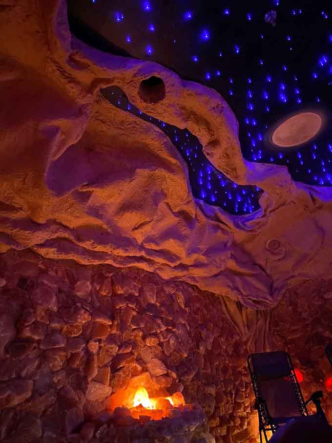 The cave transforms with color-changing lights, creating an otherworldly atmosphere that's pure Instagram gold without trying.