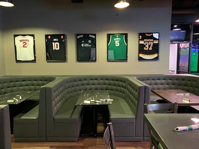 Sports jerseys mounted on walls honoring athletes who probably also appreciate a good all-you-can-eat buffet after games.