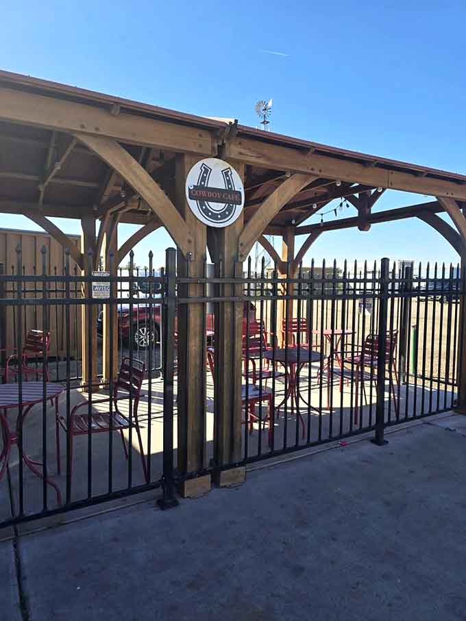 The covered patio with its horseshoe logo offers shaded seating where you can watch the world go by at Waddell's leisurely pace.