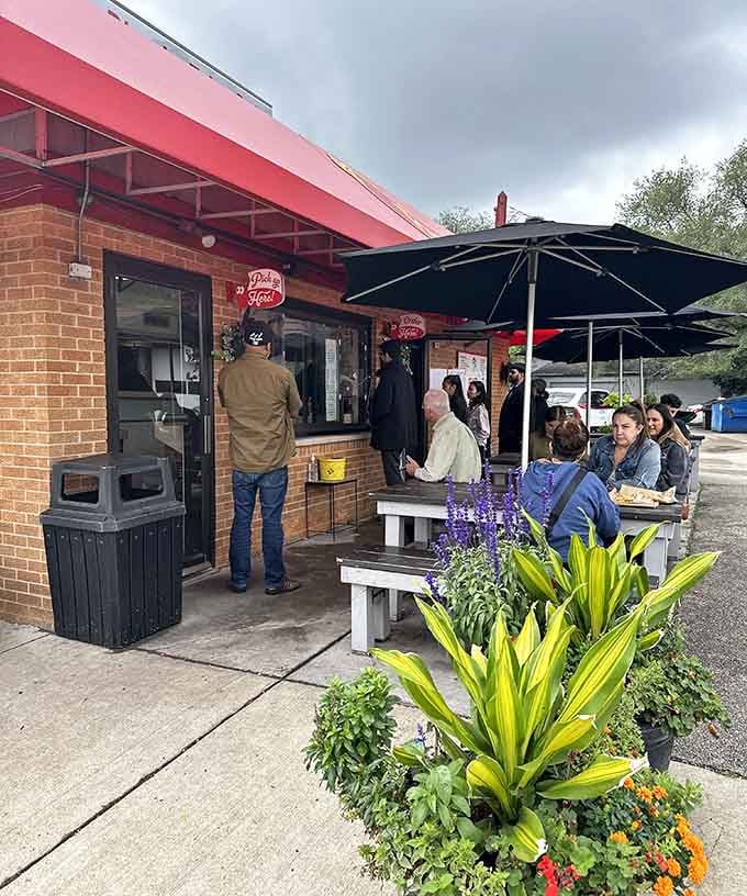 Storm clouds gathering overhead can't dampen the spirits of folks enjoying seriously good food together here.