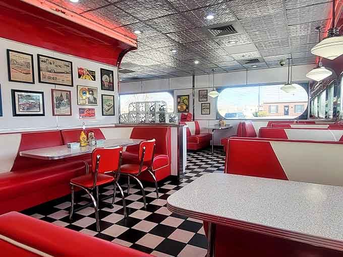 The checkered floor and chrome accents create a dining room that looks like it jumped straight out of Happy Days reruns.