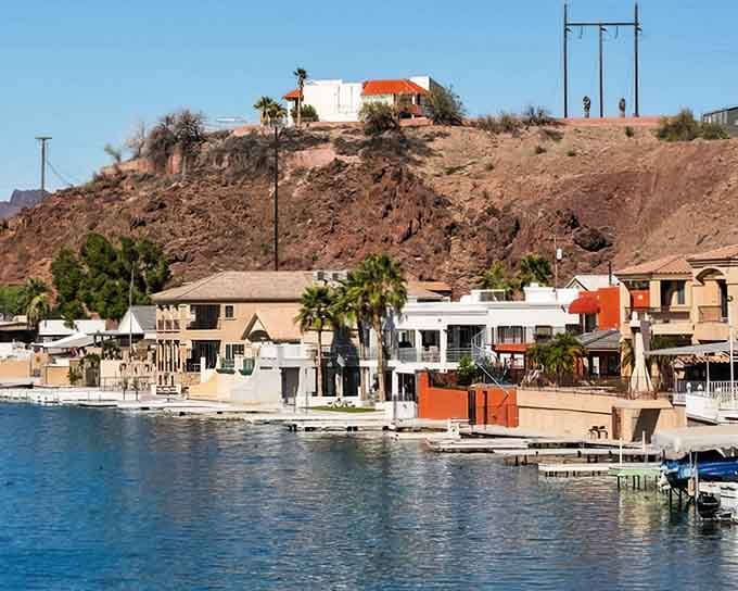 Neighborhoods sprawl comfortably along the river, where property values are measured in sunsets and water access, not square footage.