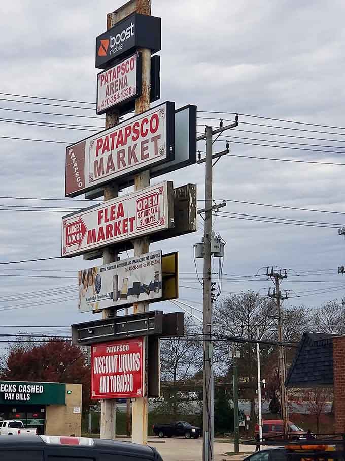 Multiple signs stacked high announce this bargain paradise to passing drivers who desperately need to pull over immediately.