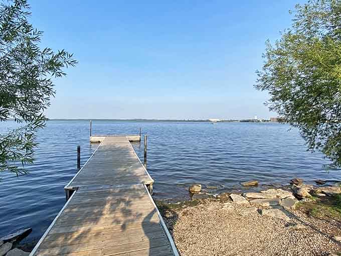 That dock stretches toward the horizon like an invitation to explore where the Mississippi River begins its journey.
