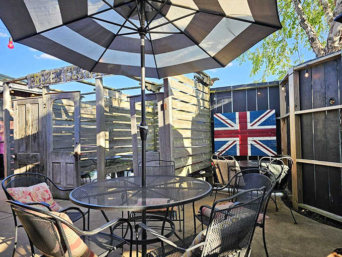 The Union Jack on the patio wall leaves zero doubt about where this menu's heart belongs.