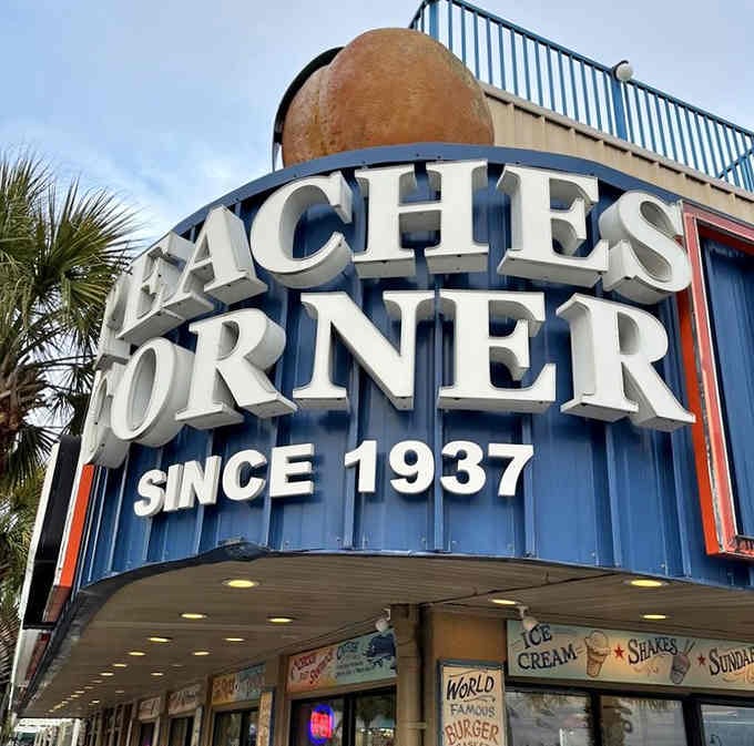 The iconic Peaches Corner sign stands proud, announcing its heritage to anyone within eyeshot of this corner.