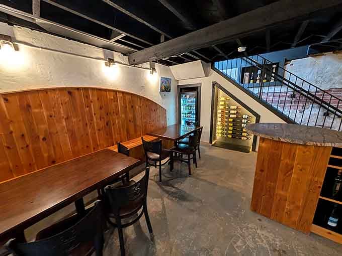 Cozy lower-level nook with wood paneling that feels like your favorite hideaway, only with better beverages.
