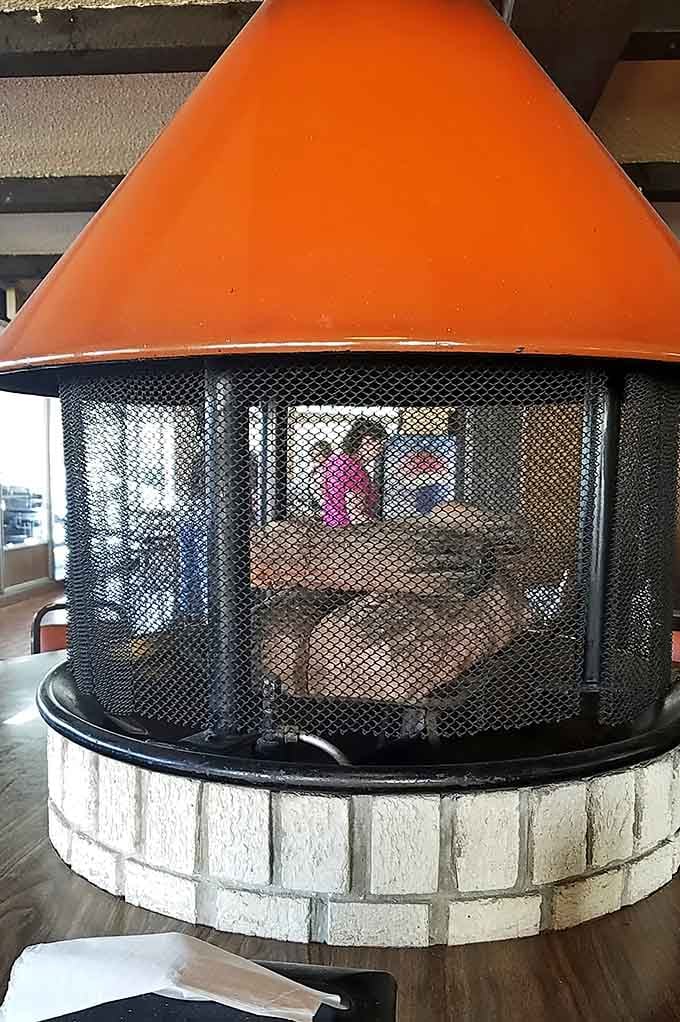 The fireplace detail showing craftsmanship and character that modern chains simply can't replicate or fake.