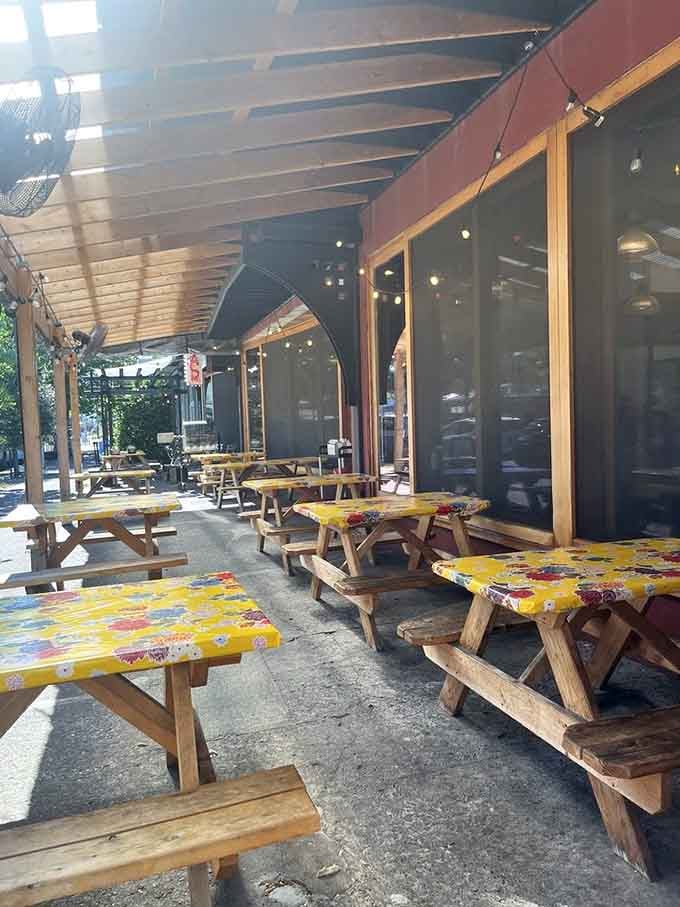 Outdoor picnic tables with cheerful tablecloths invite you to enjoy your meal in the fresh Portland air.