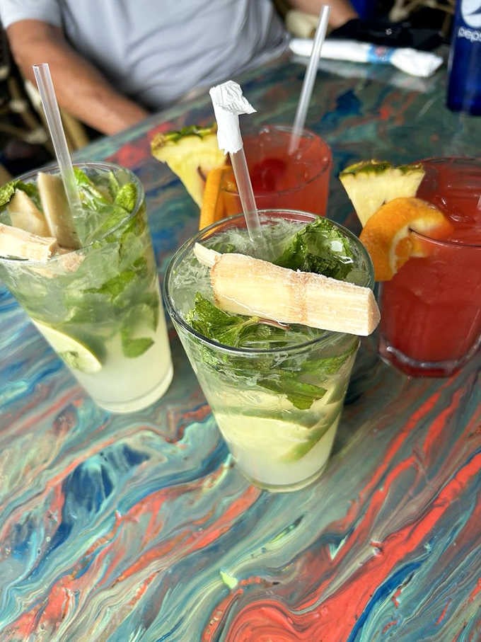 Fresh mojitos with pineapple garnishes taste like vacation decided to take liquid form and jump into glasses.