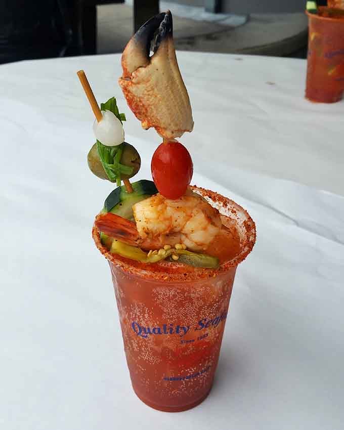 That Michelada topped with a whole crab claw is basically a meal and a cocktail having a party together.