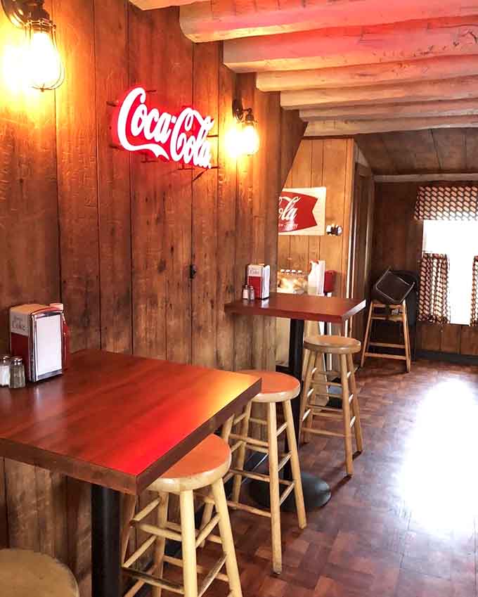 That glowing Coca-Cola sign has witnessed more happy meals than most restaurants will ever serve in their lifetime.