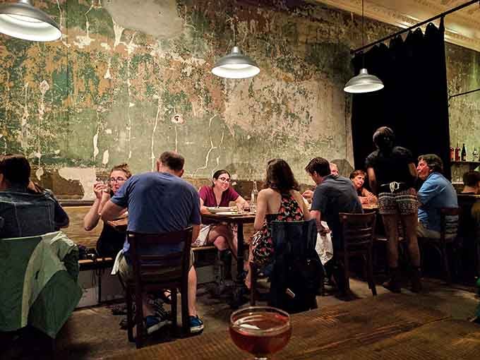 Diners gathered around tables sharing pizza and stories &ndash; this is what eating out should always feel like, honestly.